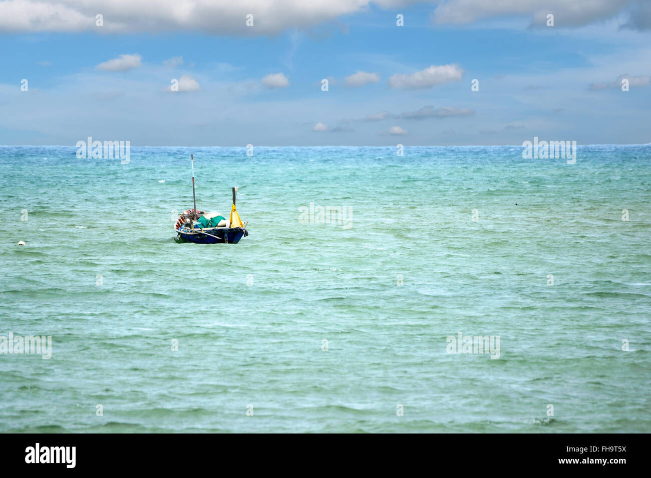 Fishing boats floating in the sea Stock Photo - Alamy