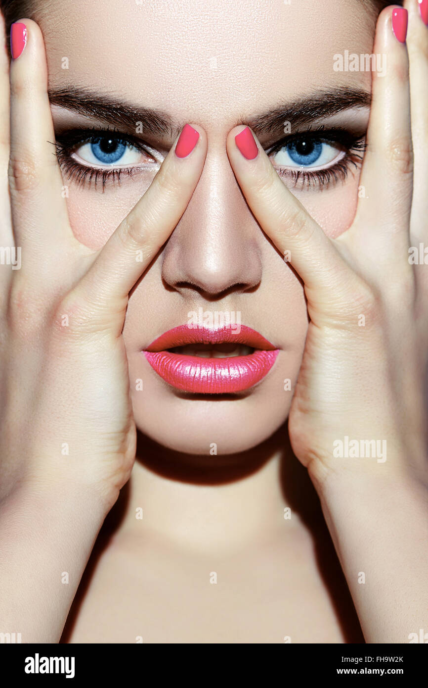 Hands on the face of the girl Stock Photo - Alamy