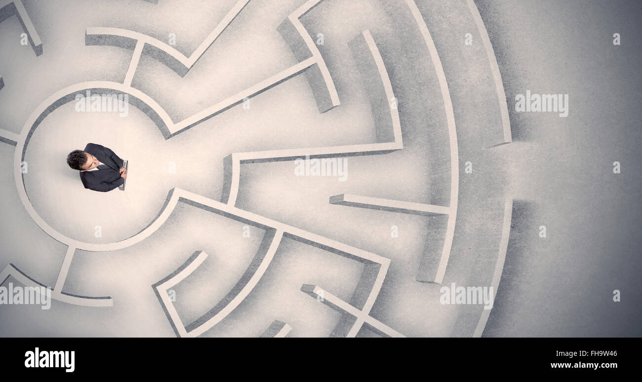 Business man trapped in a circular maze Stock Photo - Alamy