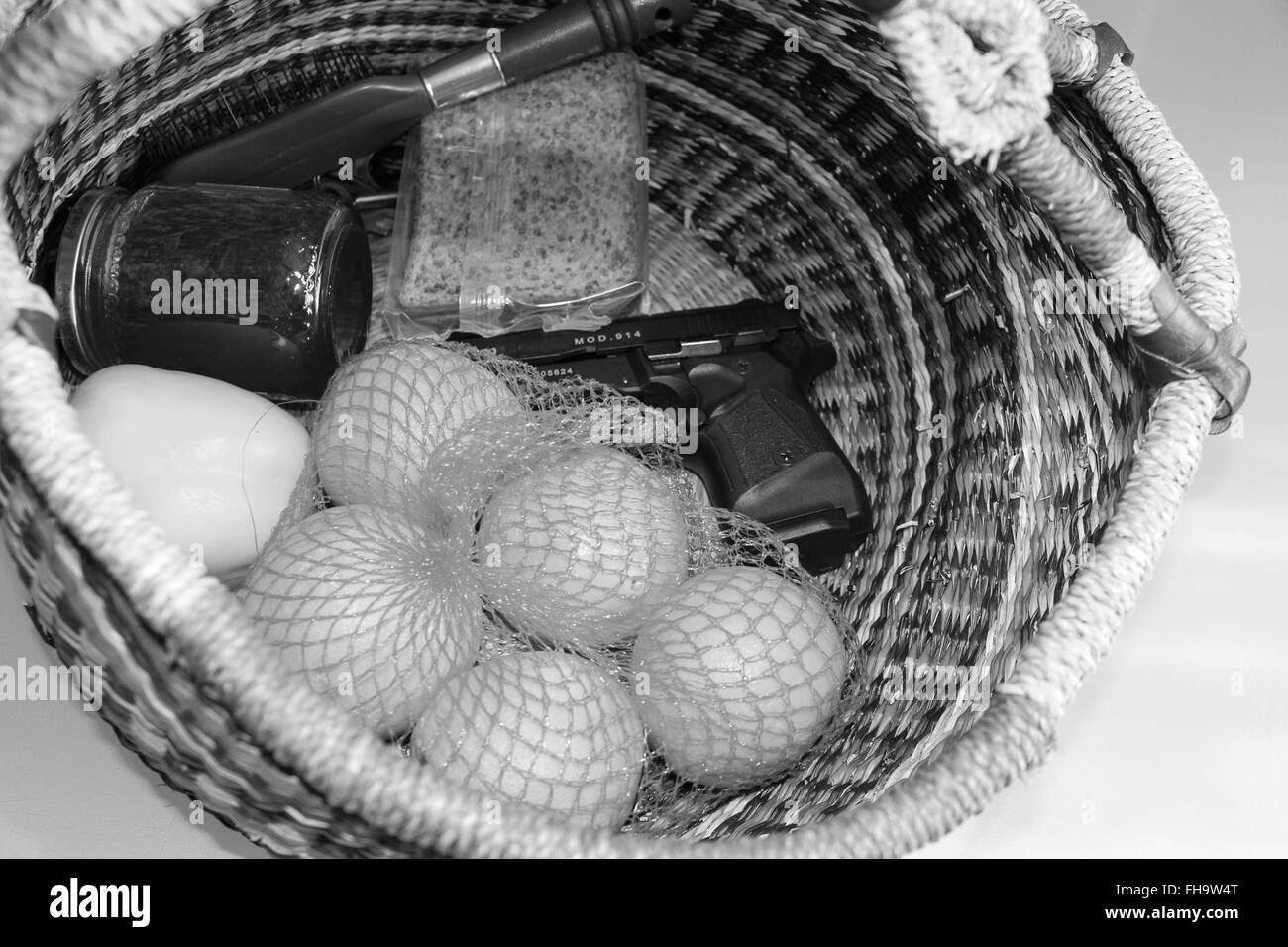 Carried concealed. Handgun and accessories in a shopping basket Stock ...