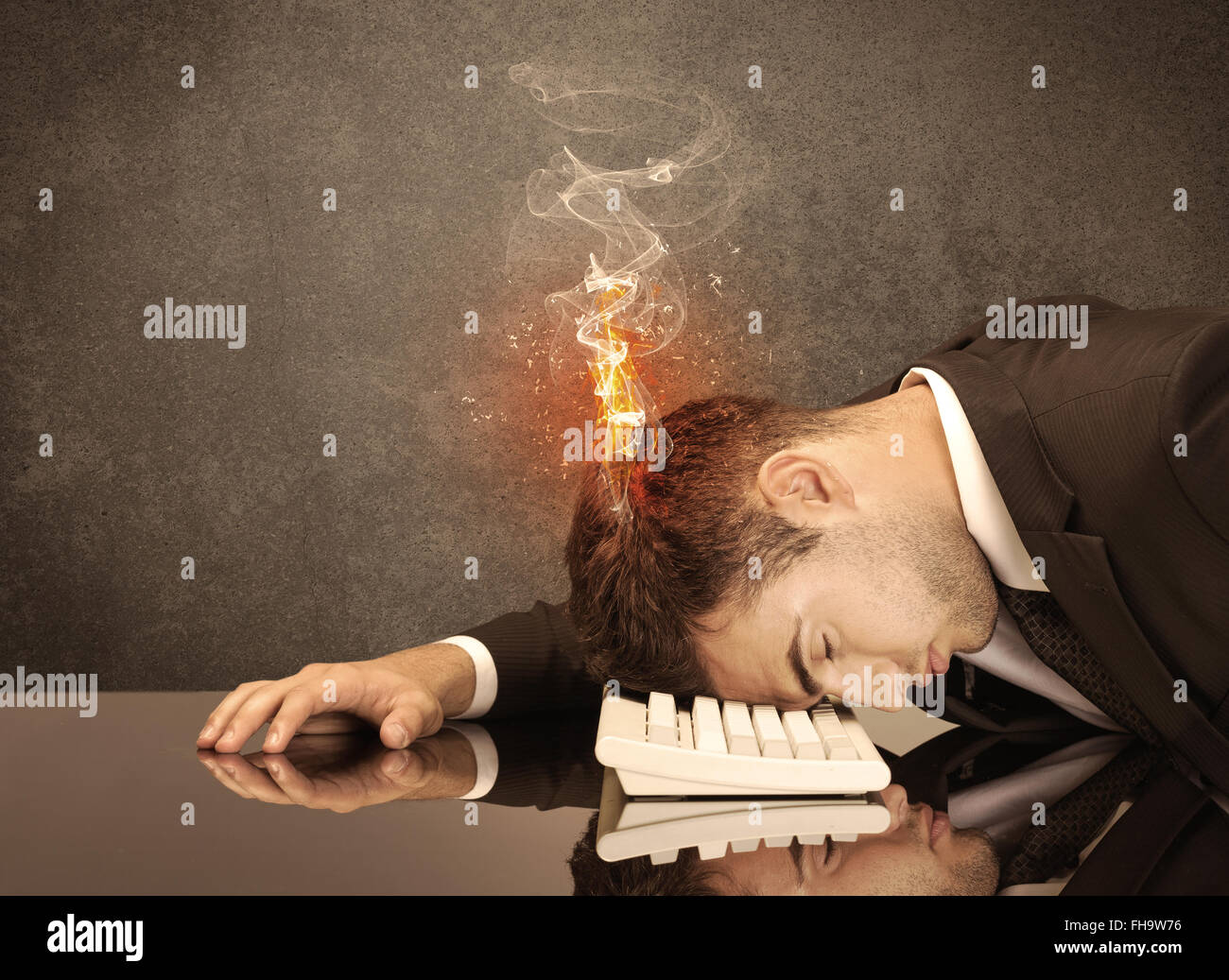 Sad business person's head catching fire Stock Photo - Alamy