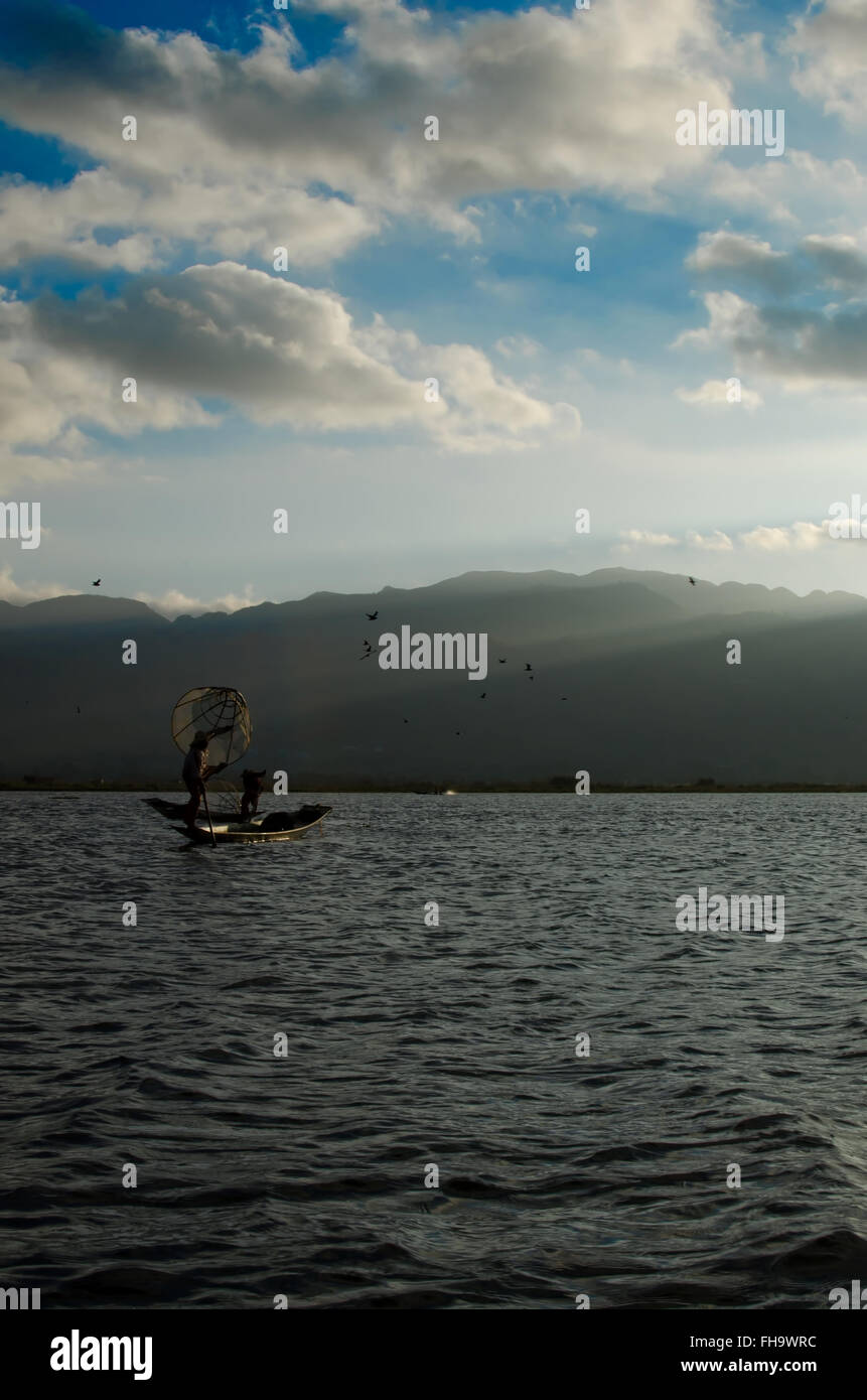 Fishermen and seagulls on Inle lake Stock Photo - Alamy