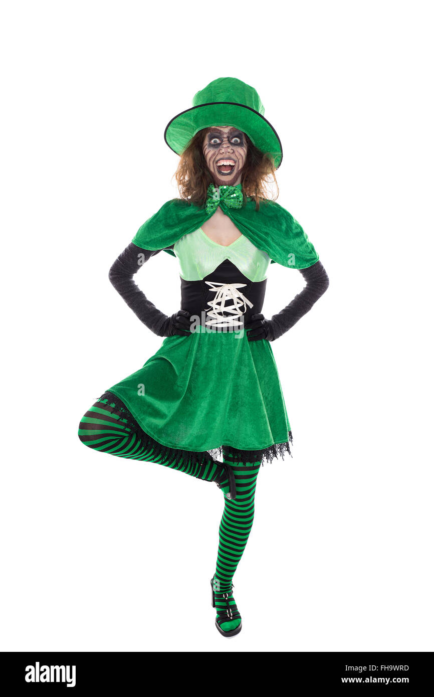 a funny dancing goblin girl, isolated on white, concept ireland and ...