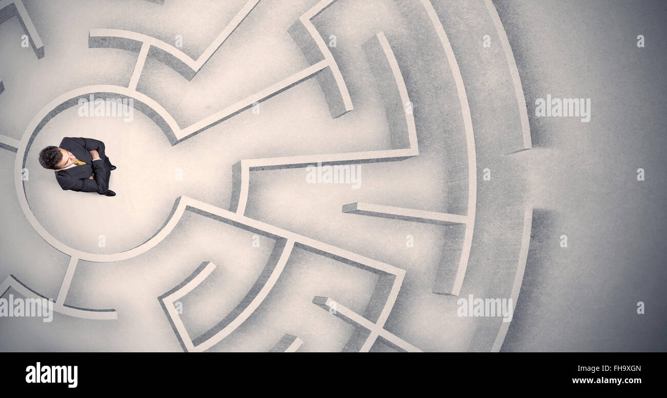 Business man trapped in a circular maze Stock Photo - Alamy