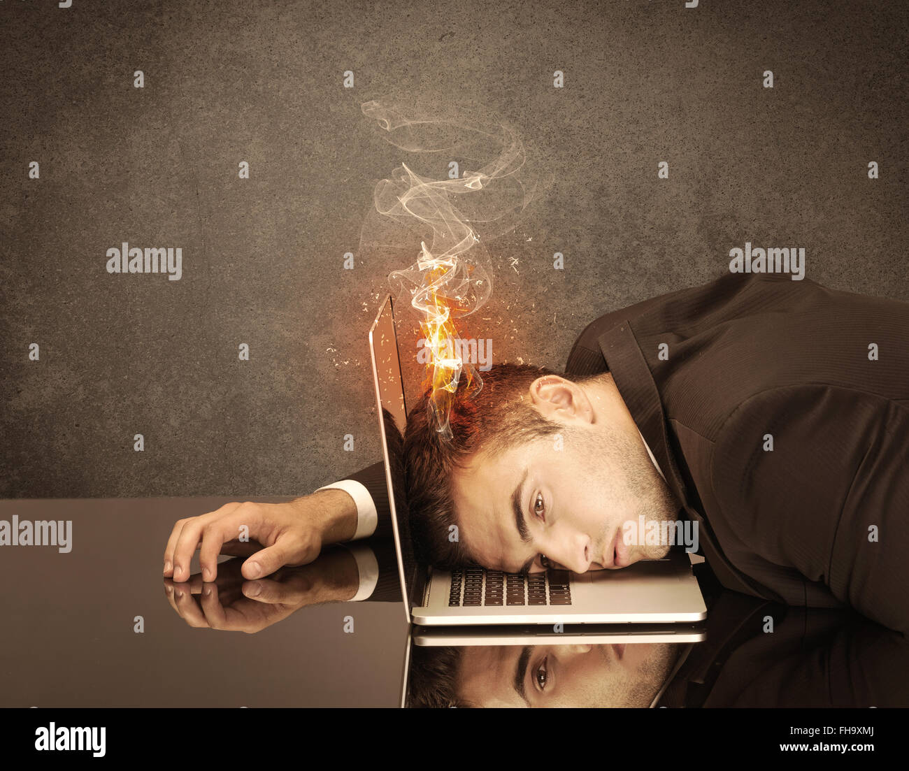 Sad business person's head catching fire Stock Photo - Alamy