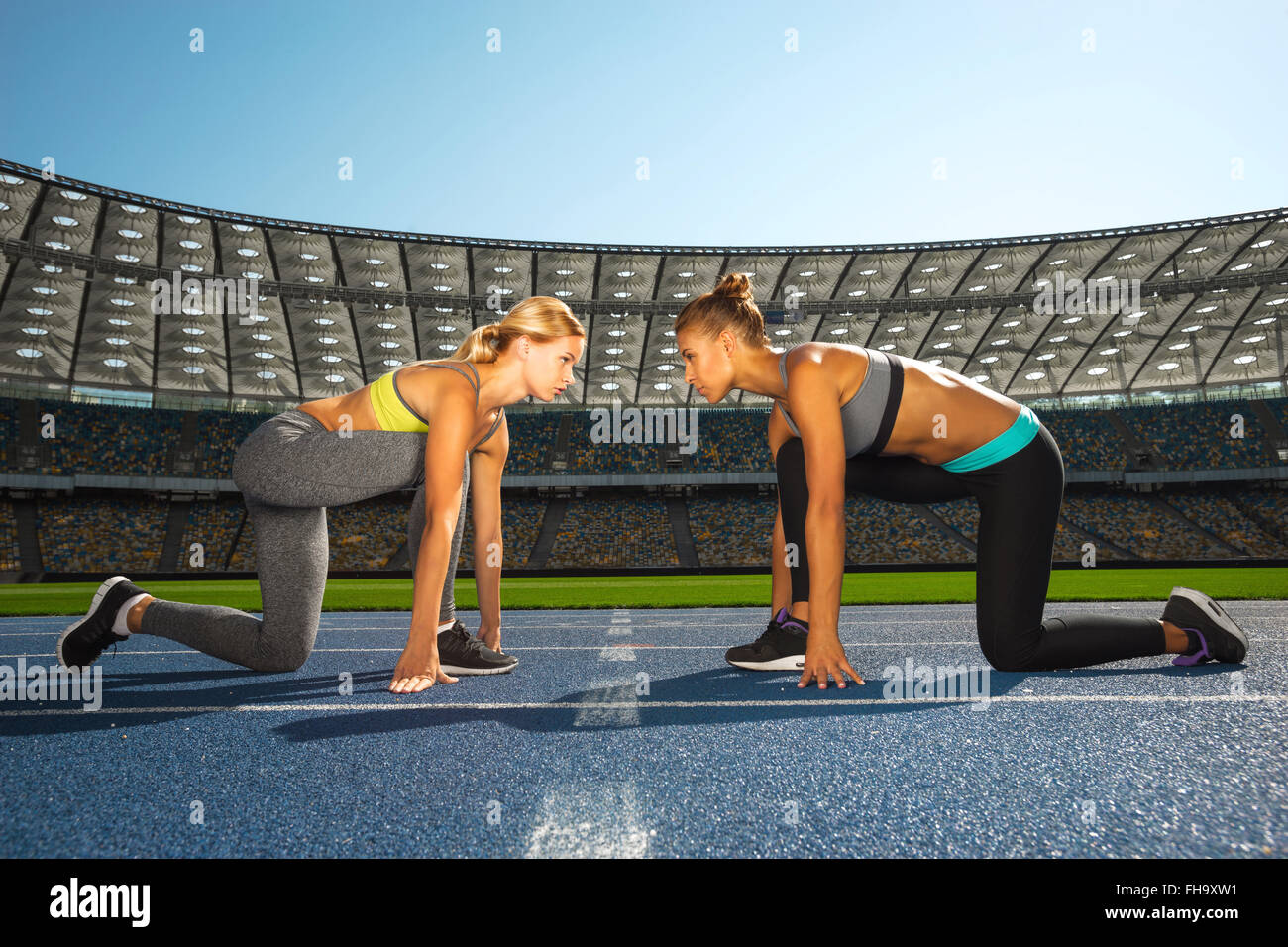 Young sporty women at large modern stadium Stock Photo - Alamy