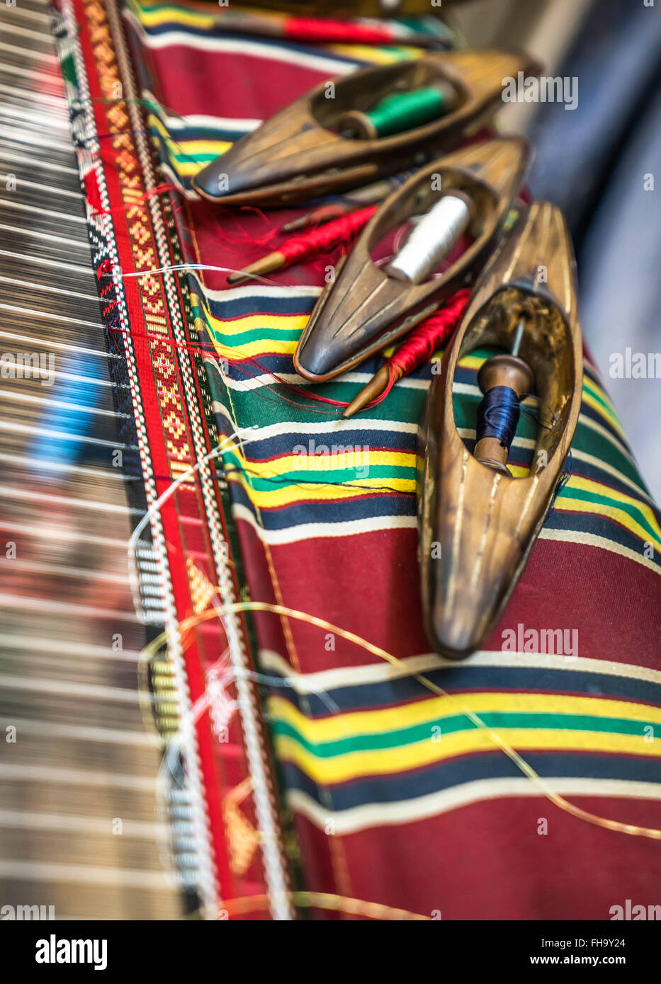 Wooden Weaving shuttles and textured textile with pattern Stock Photo ...