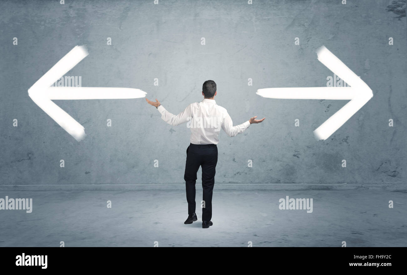 Confused business person choosing the way Stock Photo - Alamy