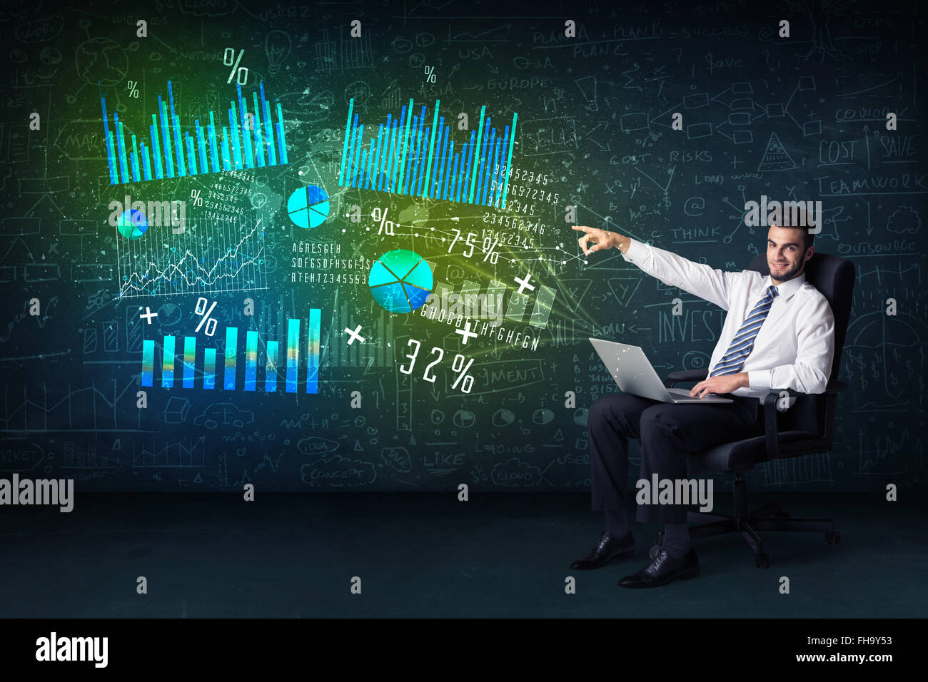 Businessman in office chair with laptop in hand and high tech graph ...