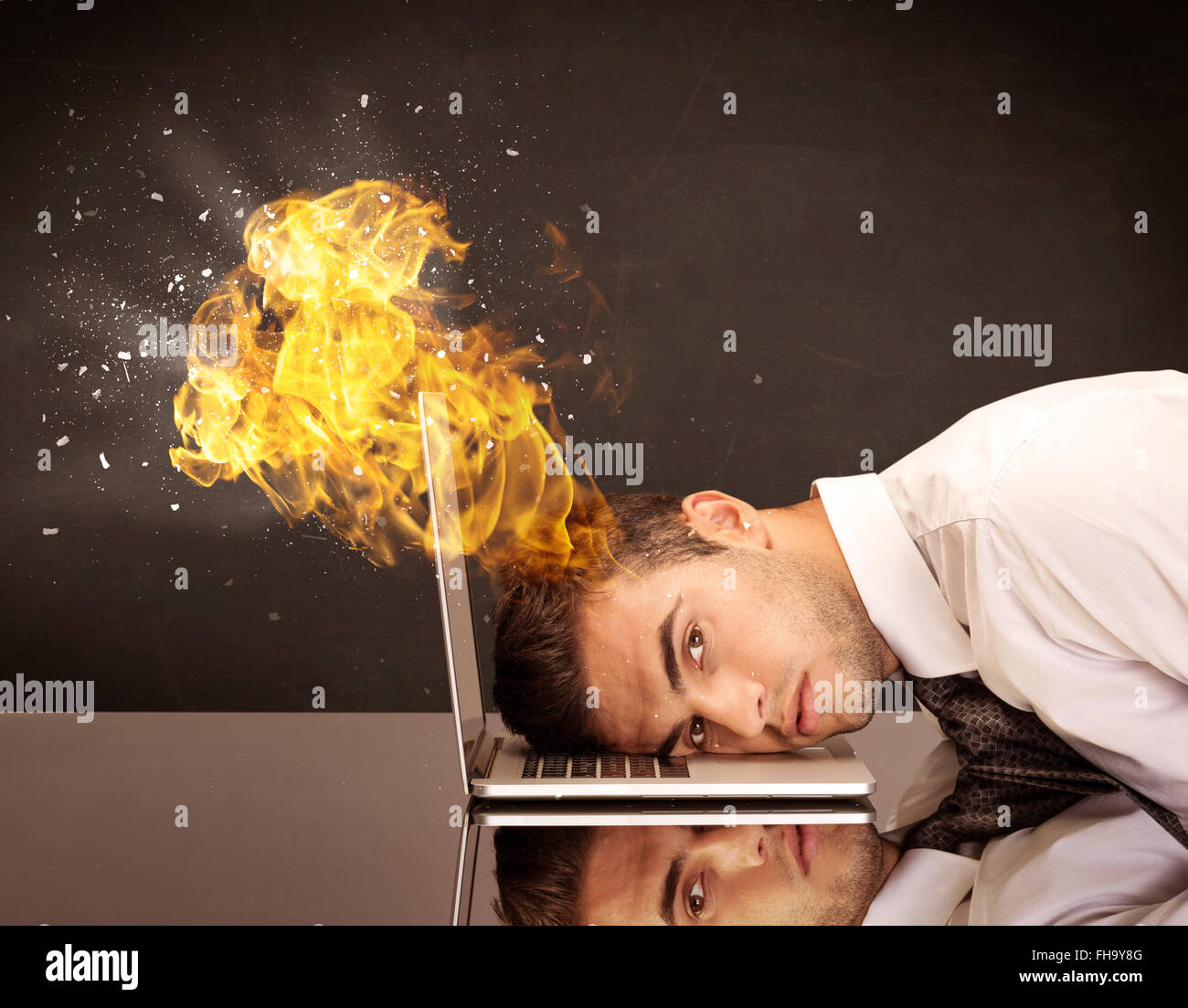 Stressed business man's head is burning Stock Photo - Alamy