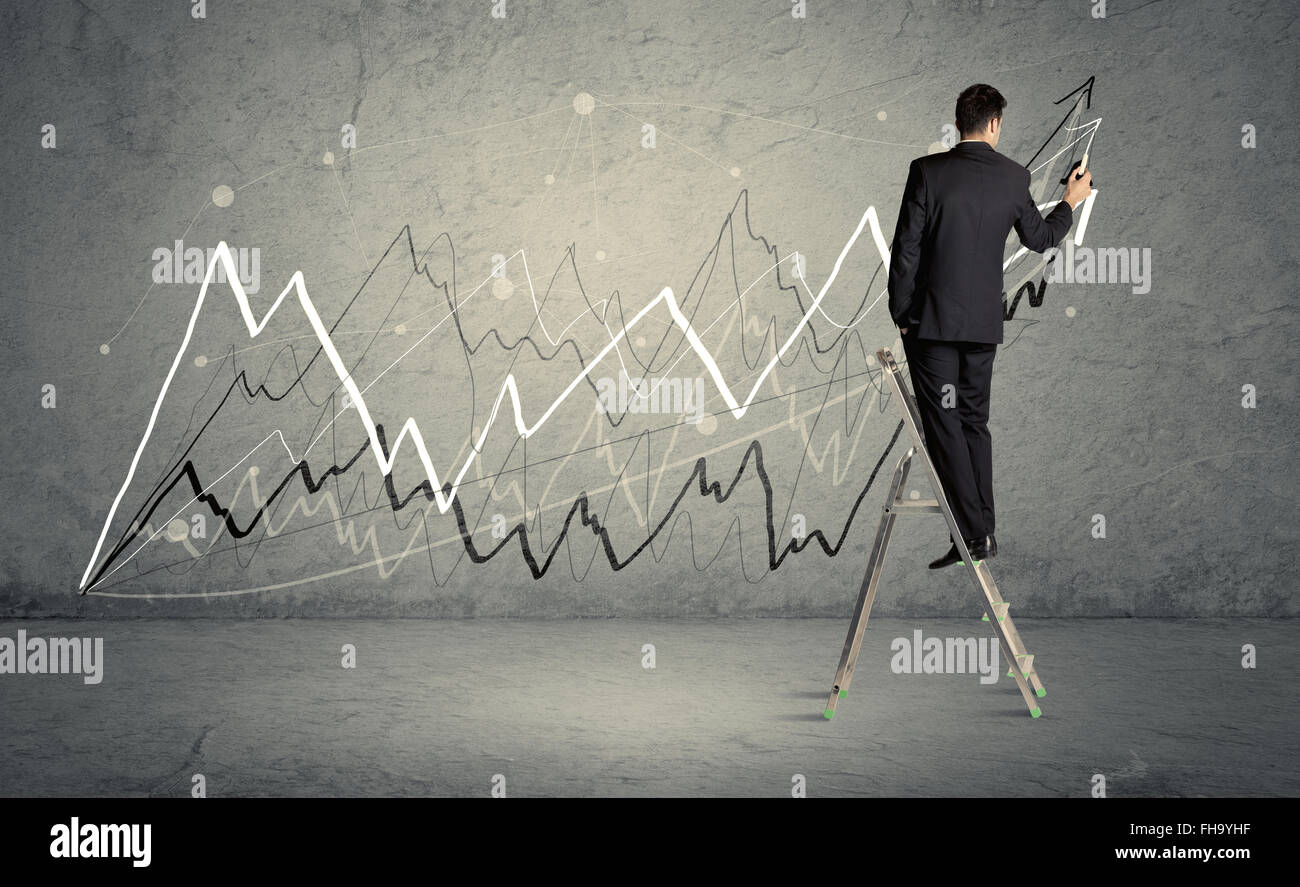 Man on ladder drawing lines Stock Photo - Alamy