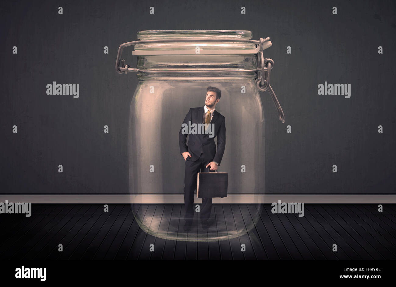 Businessman trapped into a glass jar concept Stock Photo - Alamy
