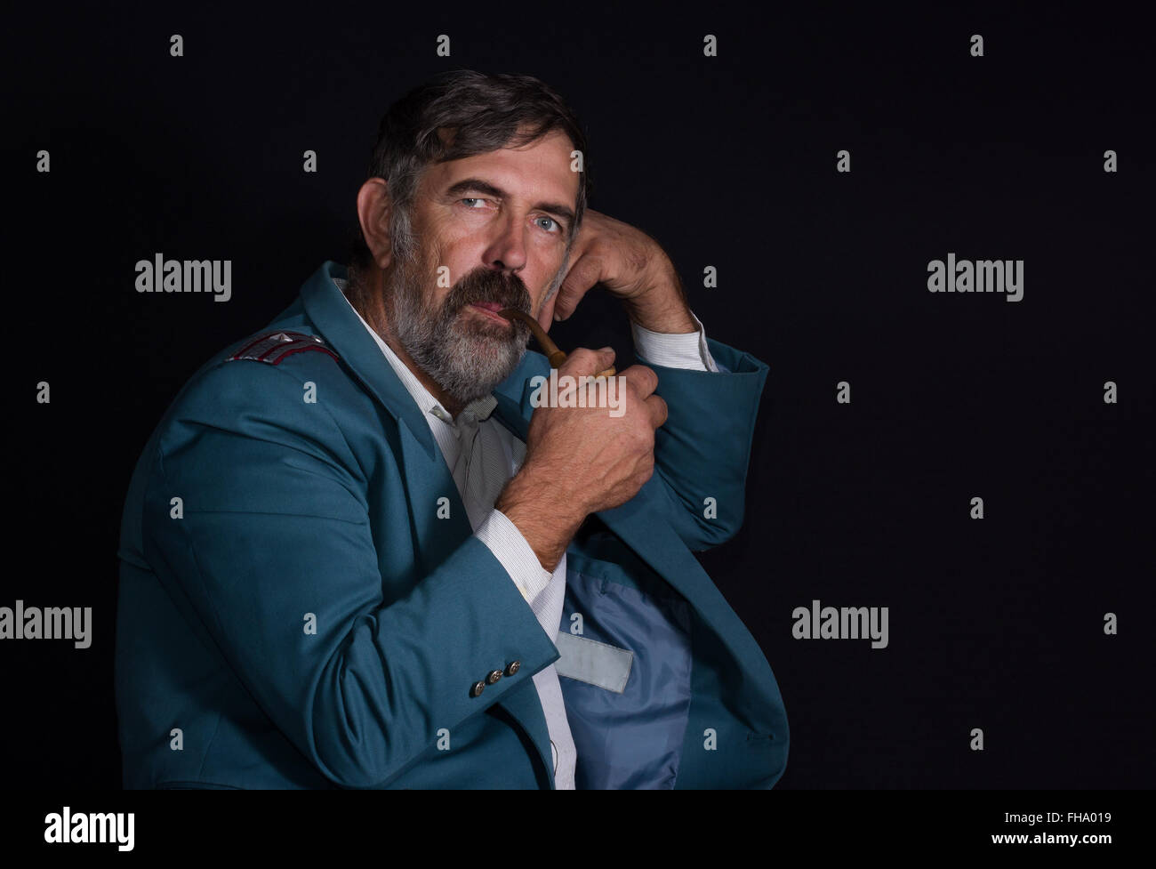 Portrait of an old retired military man holding tobacco-pipe Stock ...