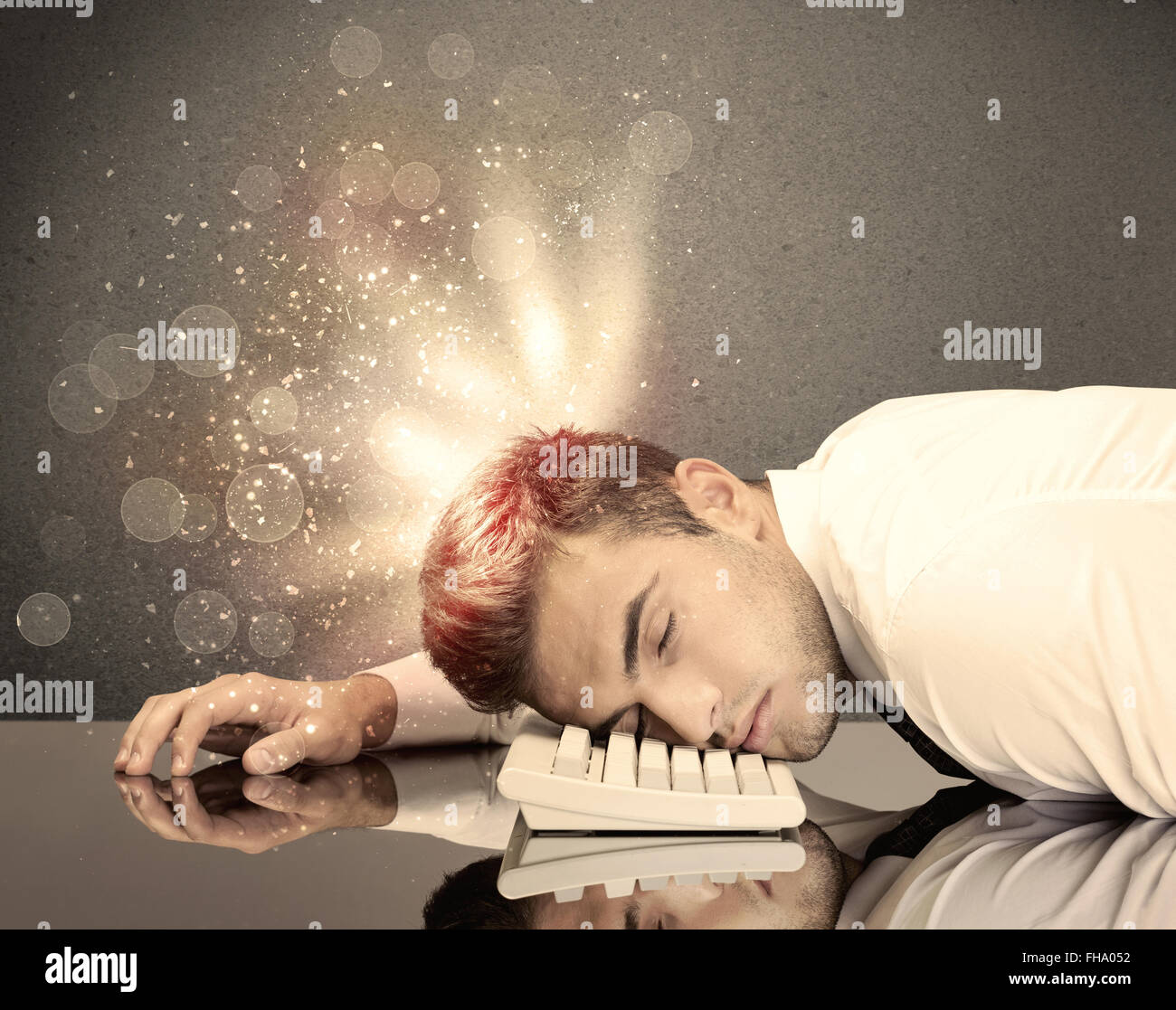 Angry businessman with lights and keyboard Stock Photo - Alamy
