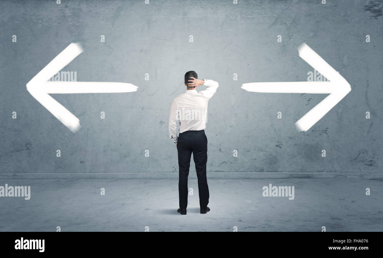 Confused business person choosing the way Stock Photo - Alamy