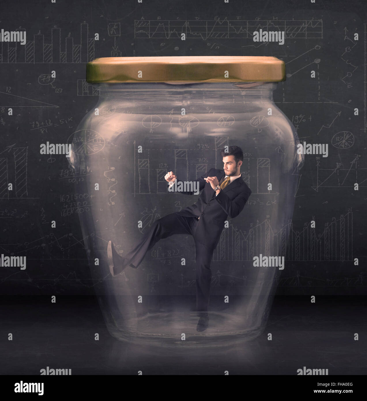 Business man closed into a glass jar concept Stock Photo - Alamy