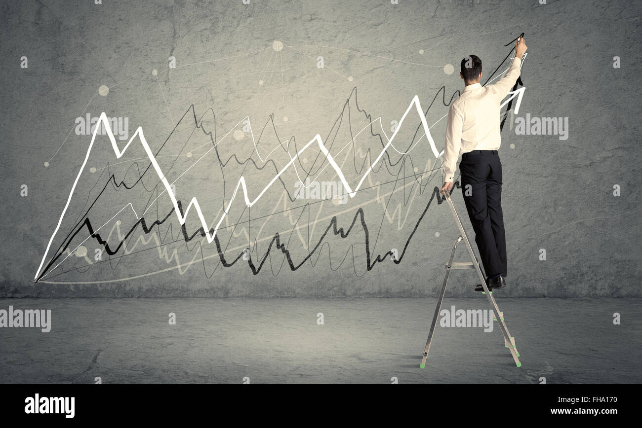 Man on ladder drawing lines Stock Photo - Alamy
