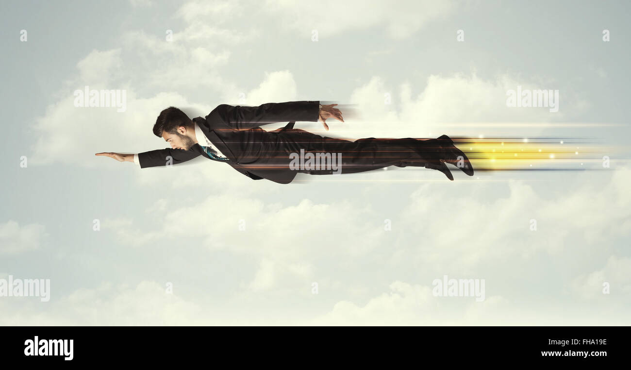 Happy business man flying fast on the sky between clouds Stock Photo ...