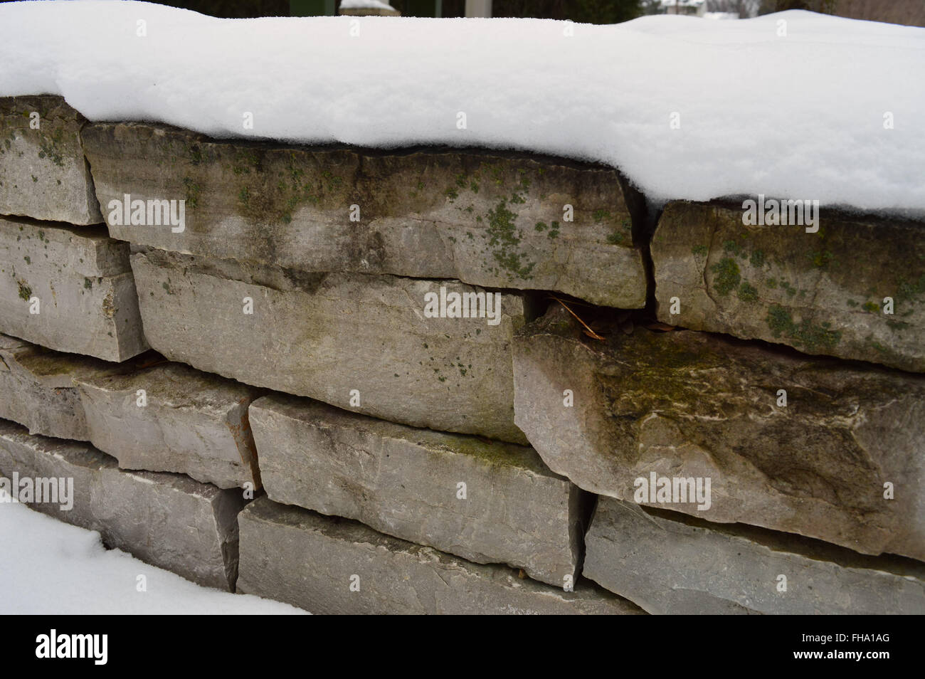 Snow on Rock Wall Stock Photo - Alamy
