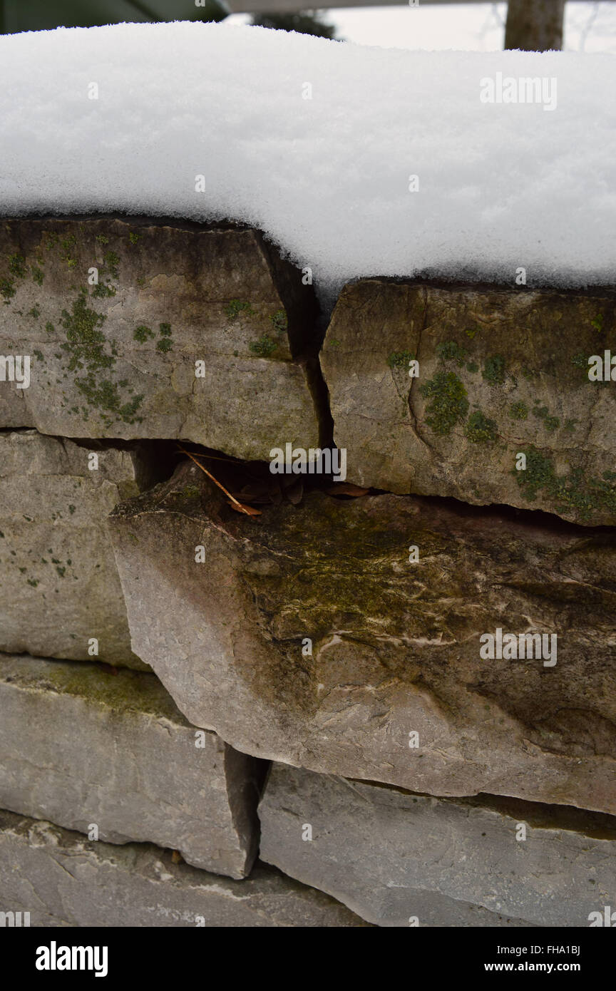 Snow on Rock Wall Stock Photo - Alamy