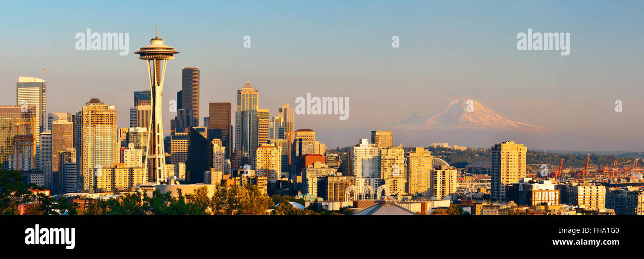 Seattle city skyline with Mt Rainier at sunset with urban office ...
