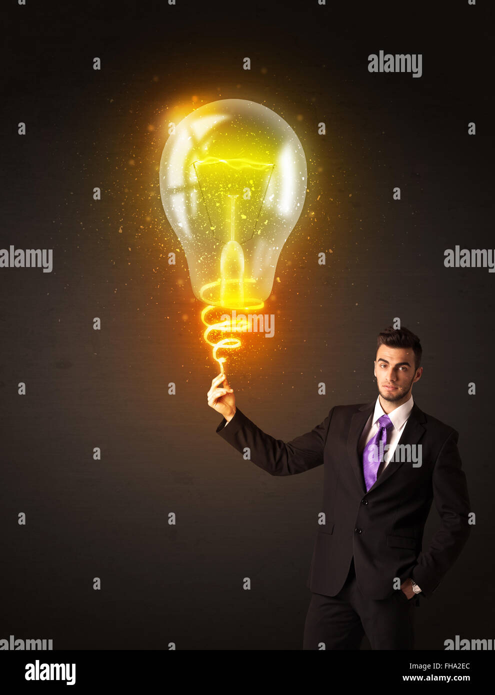 Businessman with an idea bulb Stock Photo - Alamy