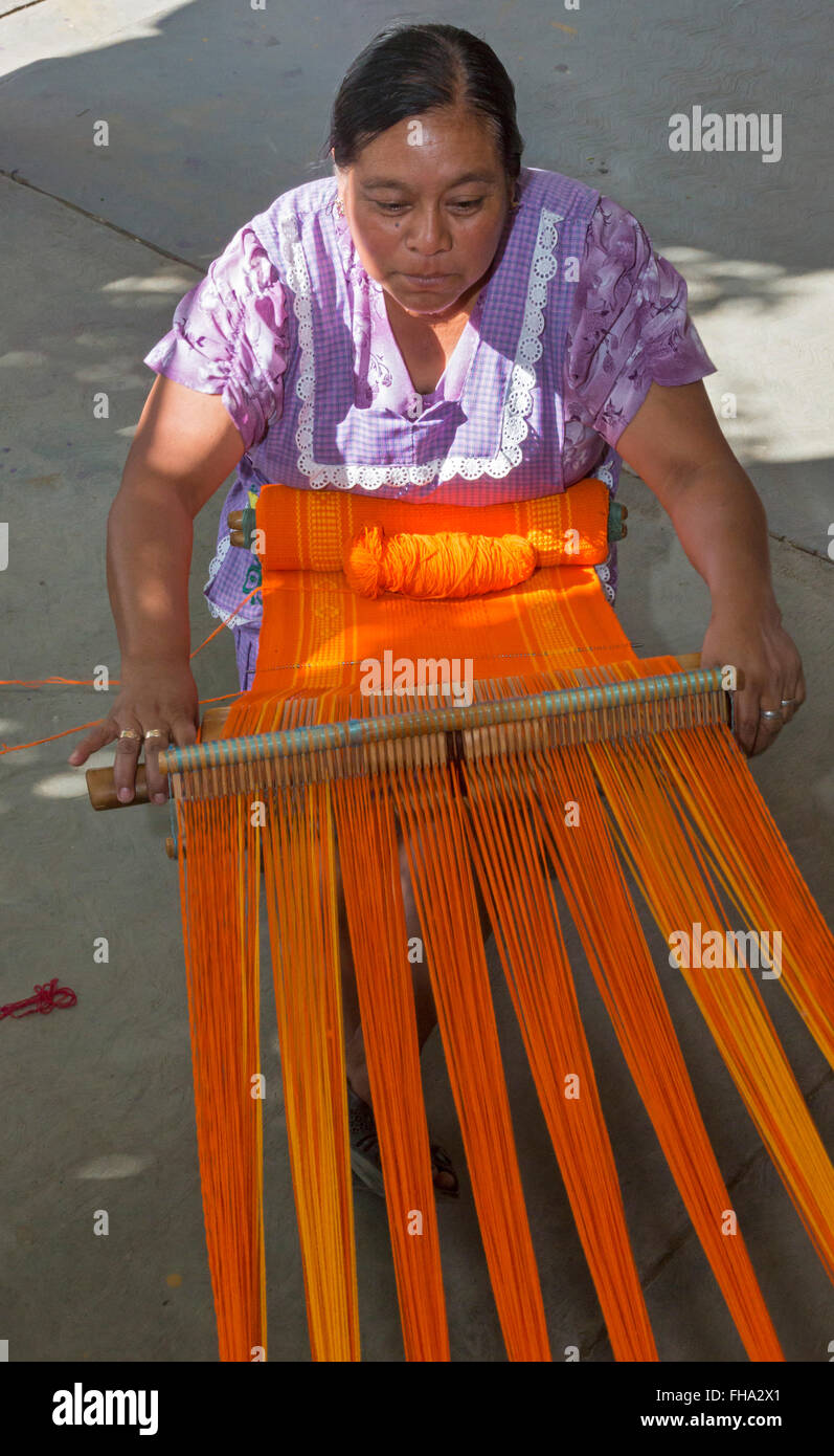 Woman weaving on back strap loom hi-res stock photography and images ...