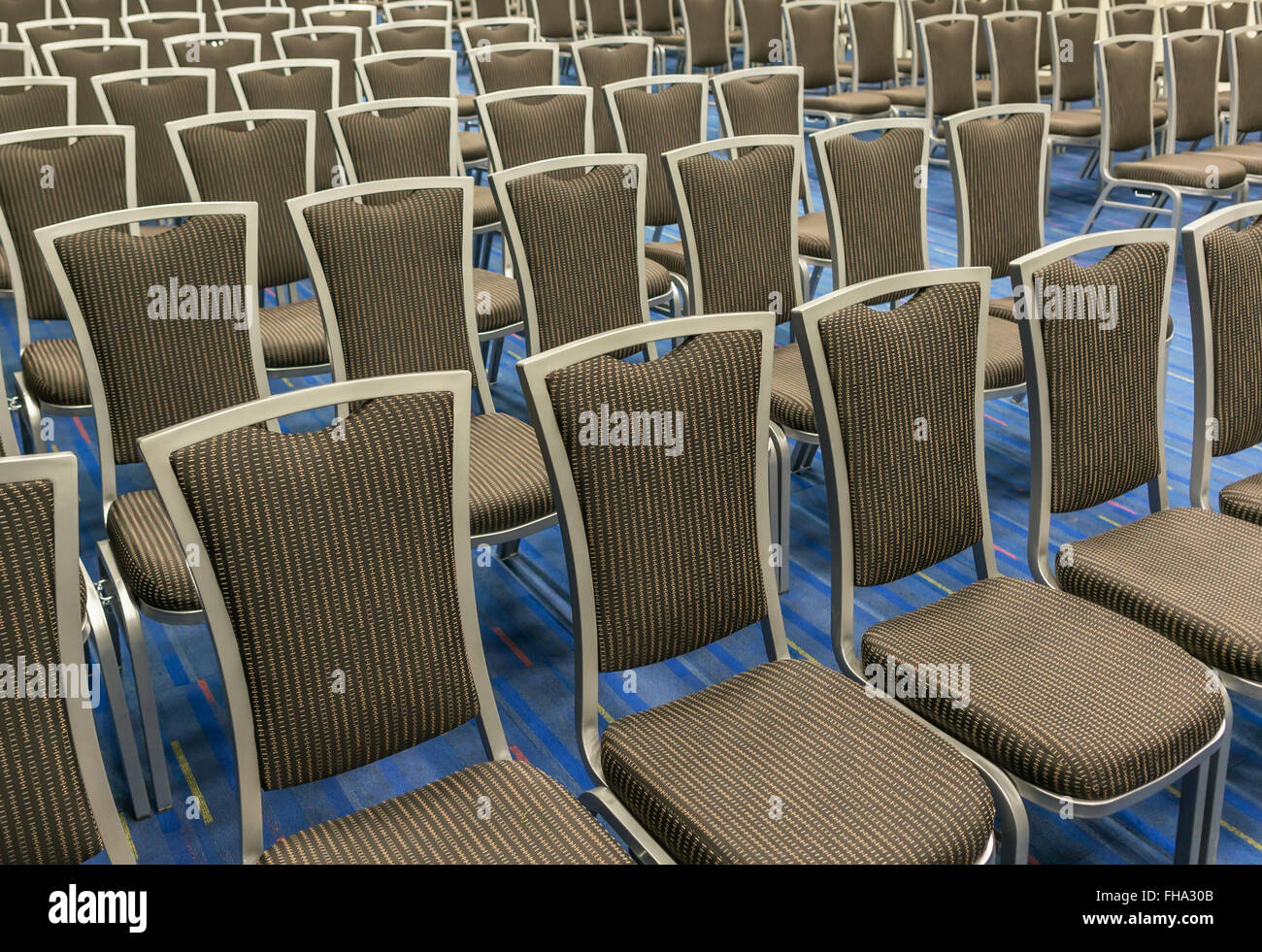 Row of the chairs in the large meeting room Stock Photo - Alamy