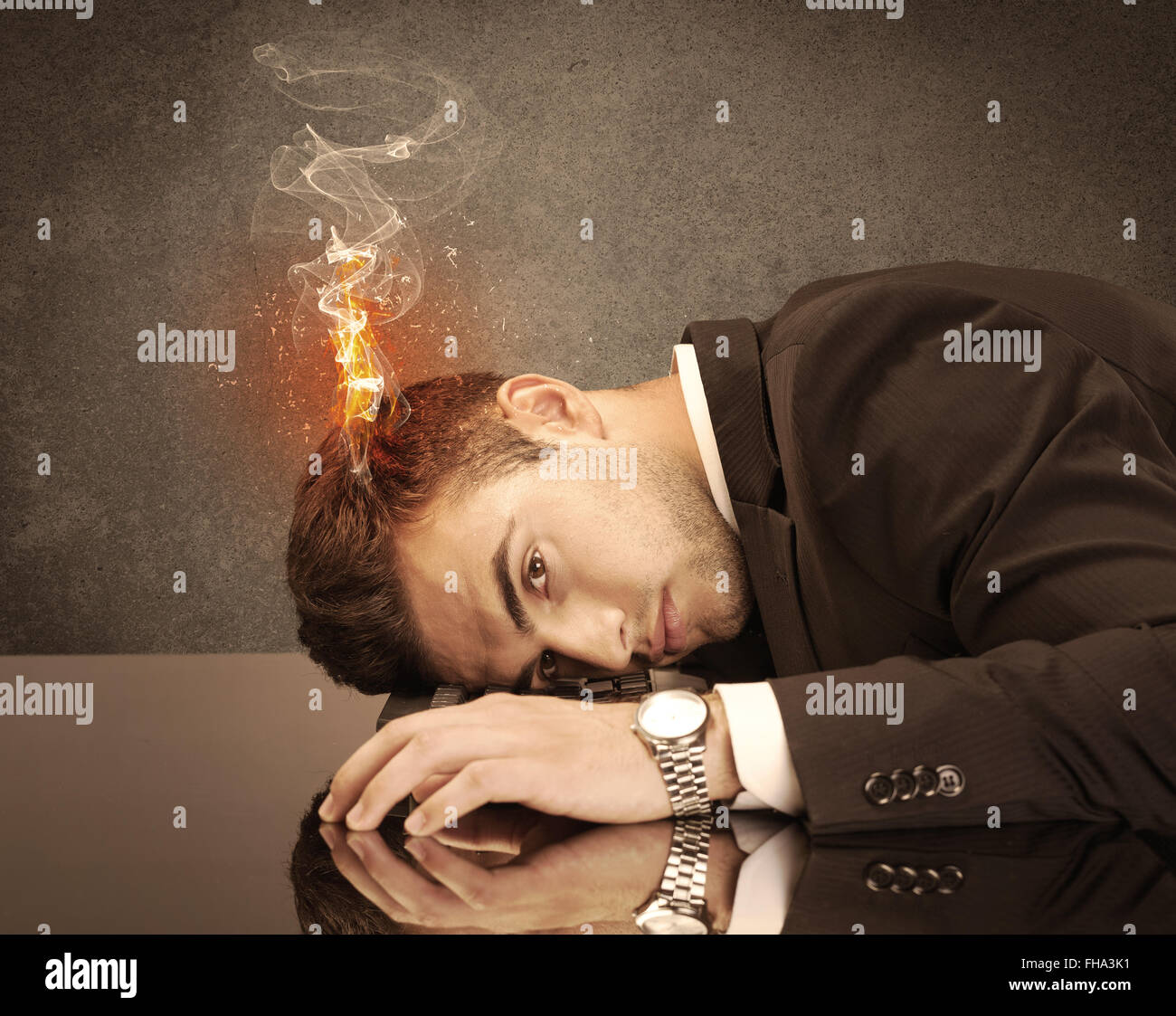 Sad business person's head catching fire Stock Photo - Alamy