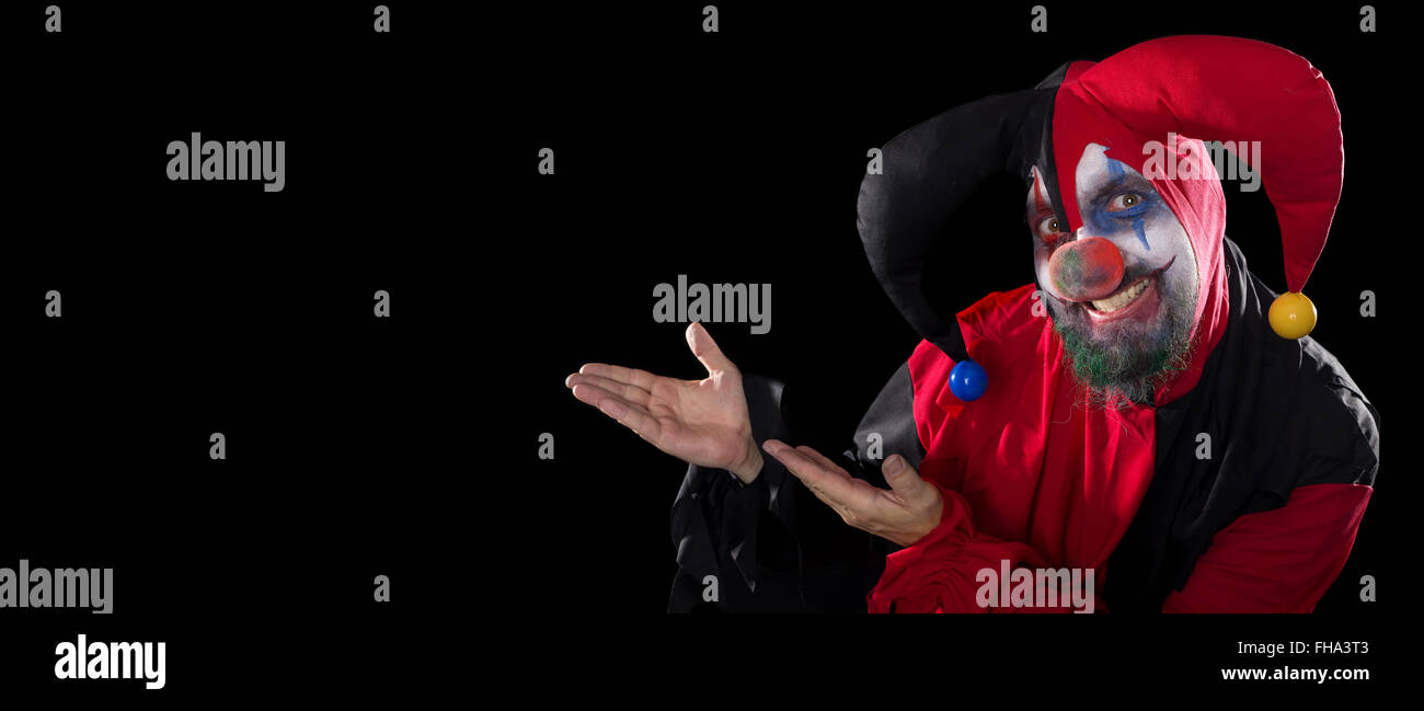 funny Jester showing to copyspace, concept halloween and horror, black ...