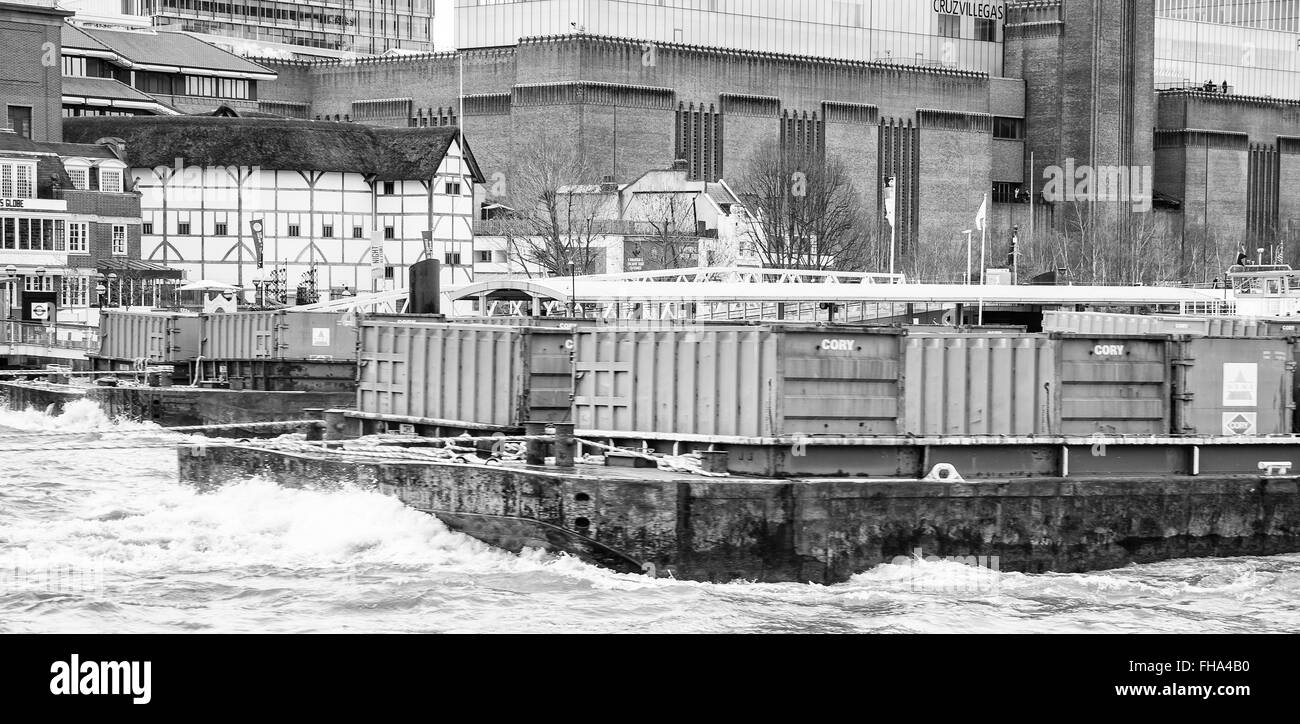 Containers on barges with spray on the Thames Stock Photo - Alamy