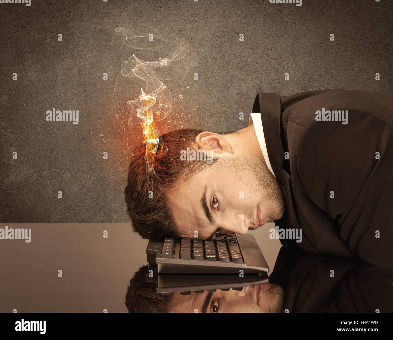 Sad business person's head catching fire Stock Photo - Alamy