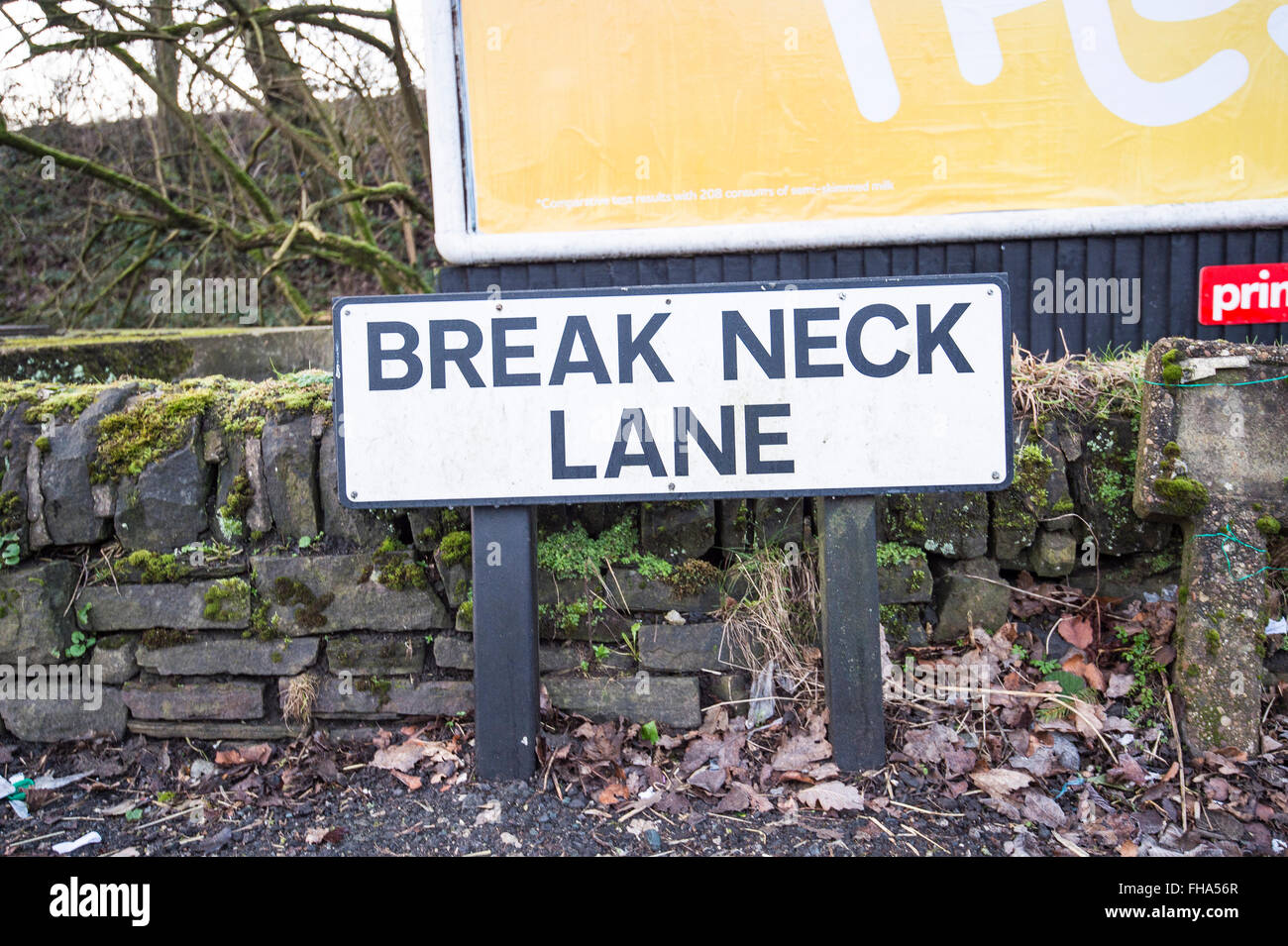 Break Neck Lane road sign in front of low stone wall Stock Photo - Alamy