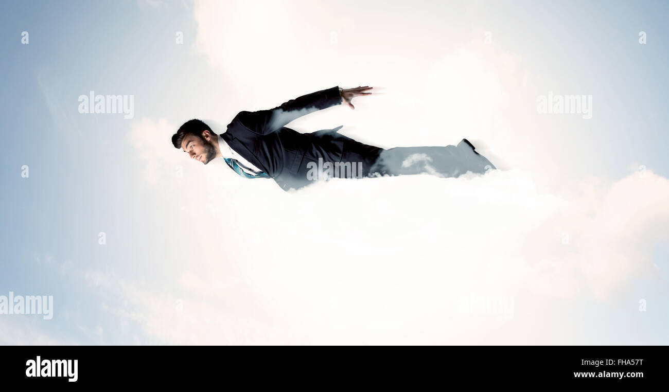 Business man flying like a superhero in clouds on the sky Stock Photo ...