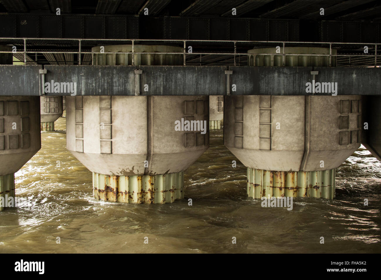 Bridge supporting columns rising out of river Stock Photo - Alamy