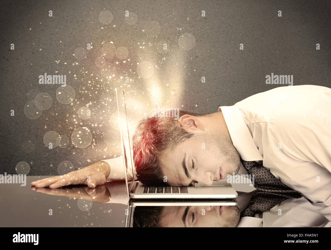 Angry businessman with lights and keyboard Stock Photo - Alamy