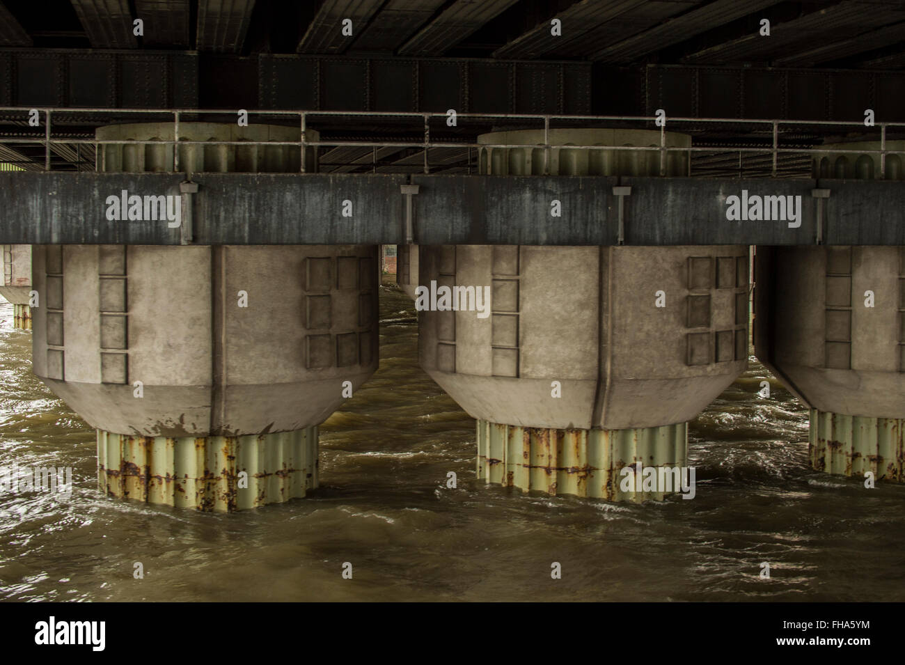 Bridge supporting columns rising out of river Stock Photo - Alamy