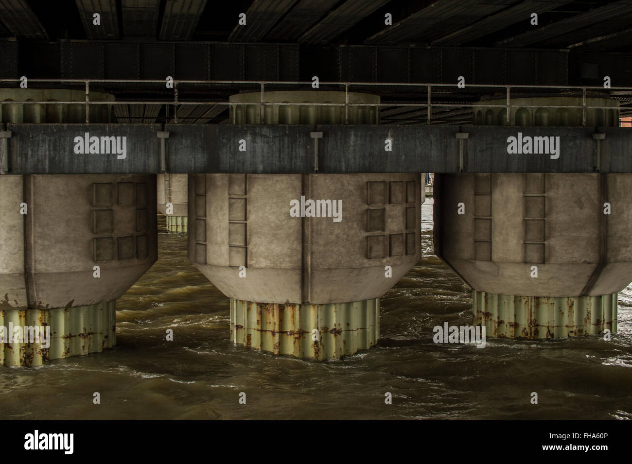 Bridge supporting columns rising out of river Stock Photo - Alamy