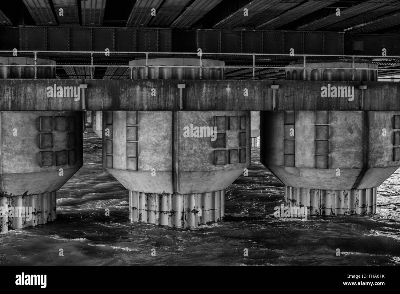 Bridge supporting columns rising out of river Stock Photo - Alamy