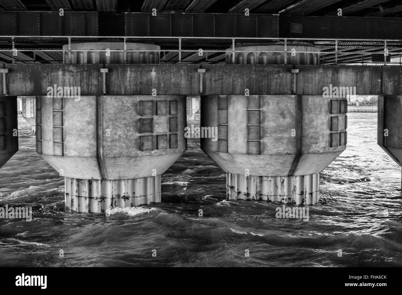 Bridge supporting columns rising out of river Stock Photo - Alamy