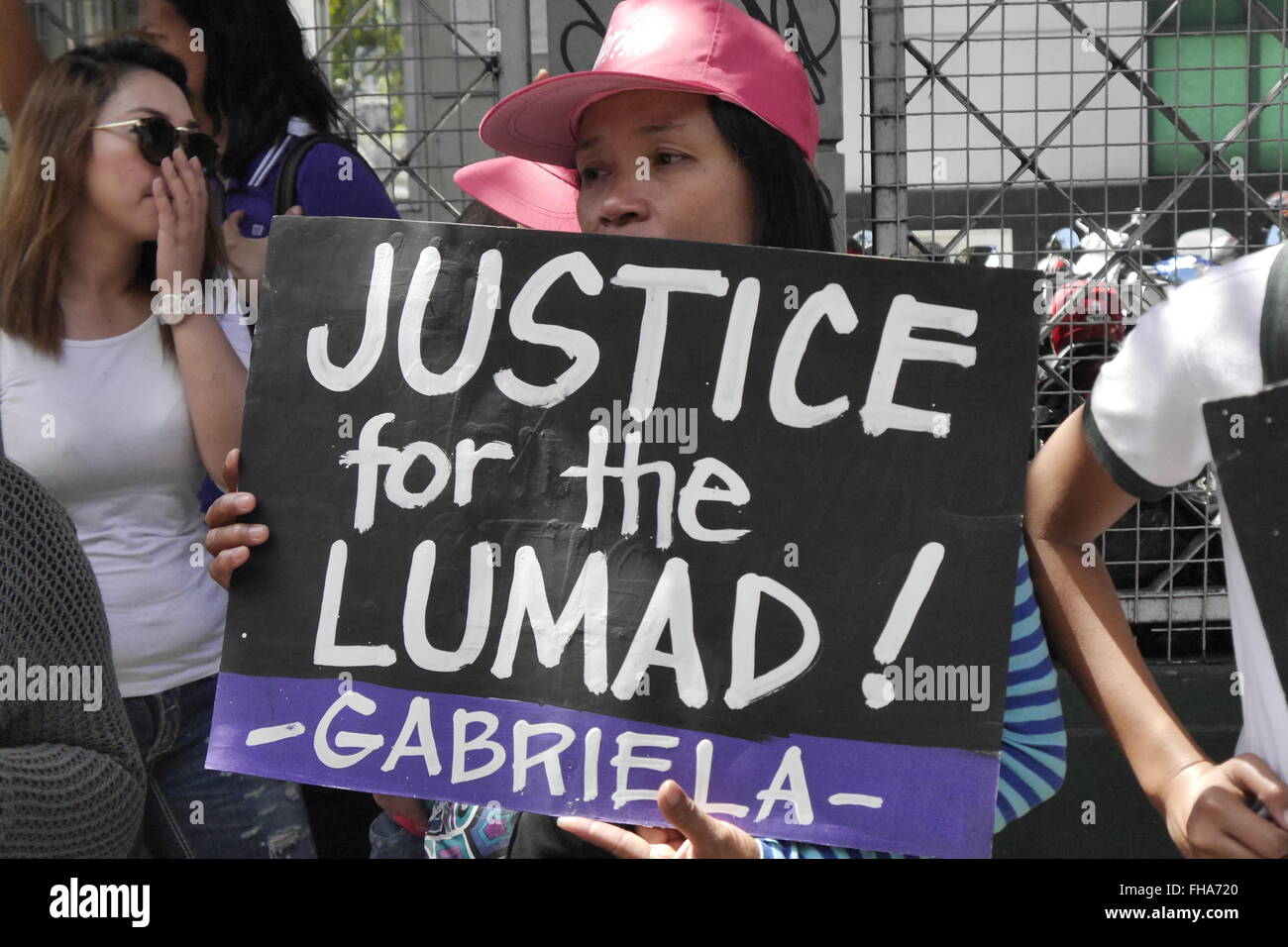 Manila, Philippines. 24th Feb, 2016. A placard by this woman to give ...