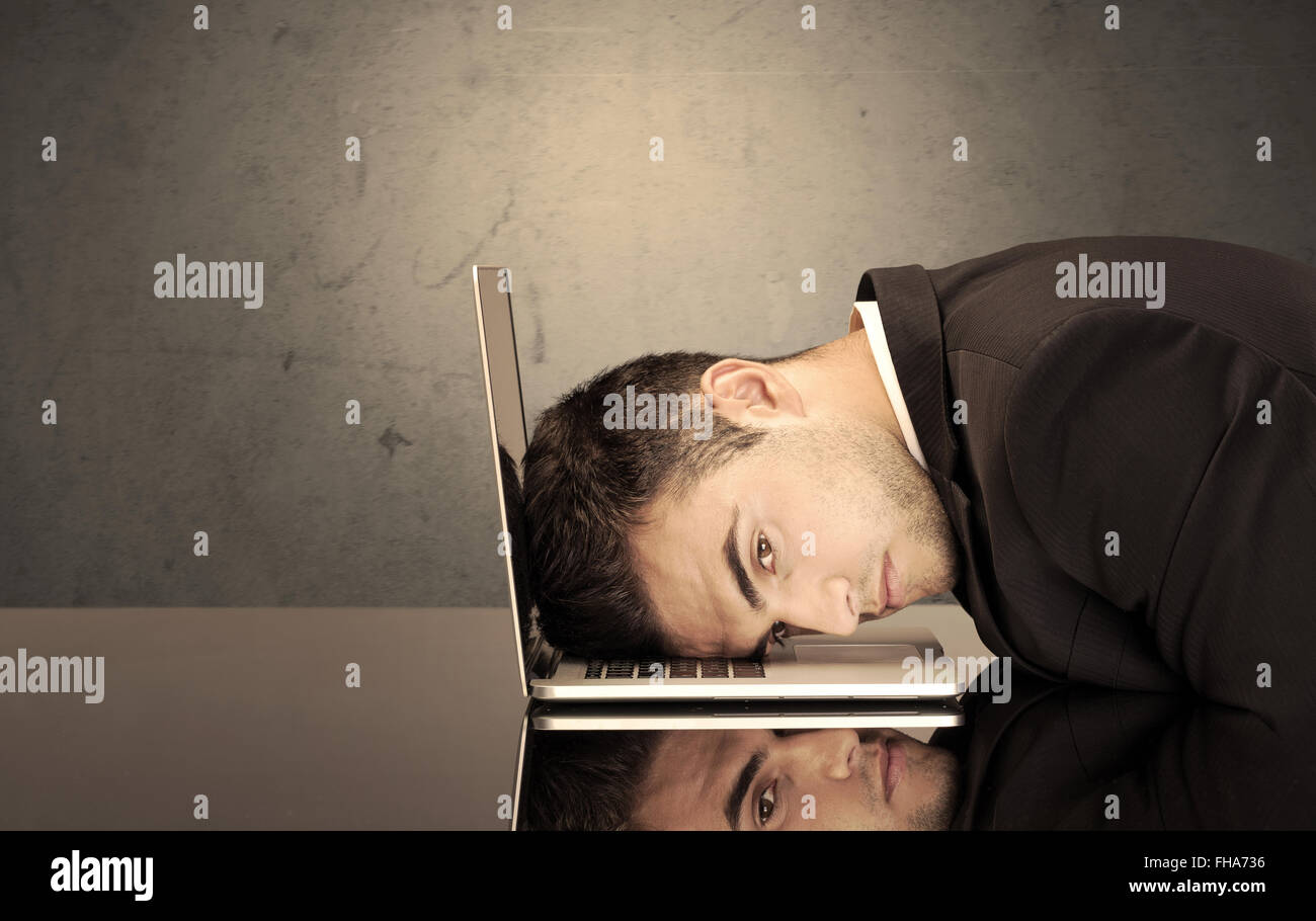 Frustrated businessman's head on keyboard Stock Photo - Alamy