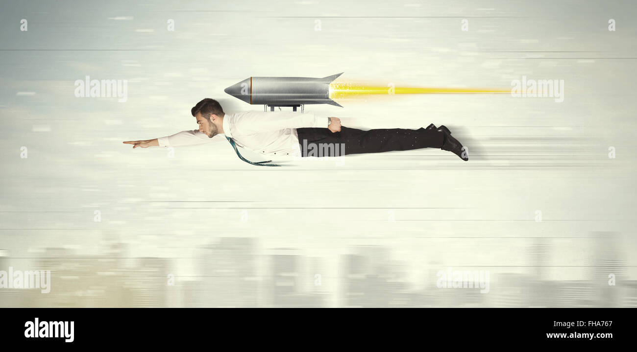 Superhero business man flying with jet pack rocket above the city Stock ...