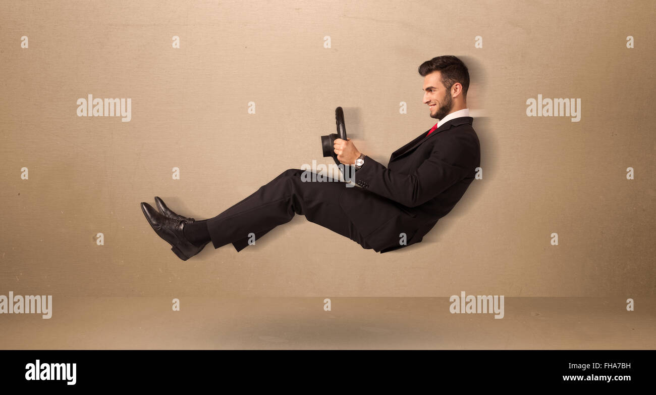 Happy funny man driving a flying car concept Stock Photo - Alamy