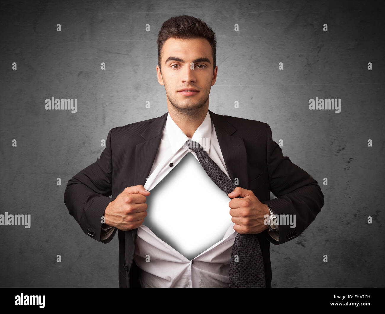 Businessman tearing off his shirt with white copyspace on chest Stock ...