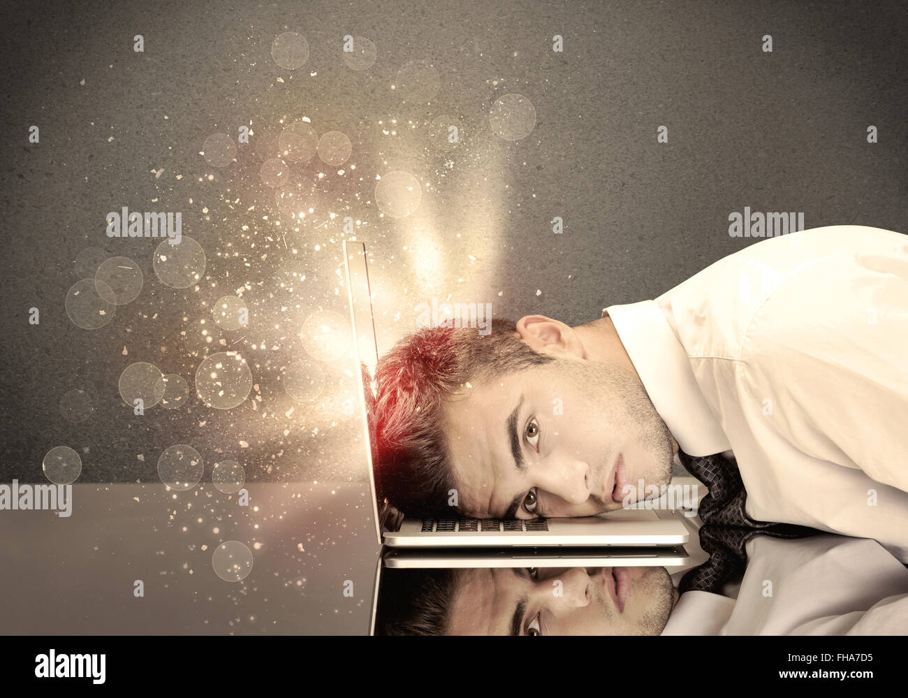 Angry businessman with lights and keyboard Stock Photo - Alamy