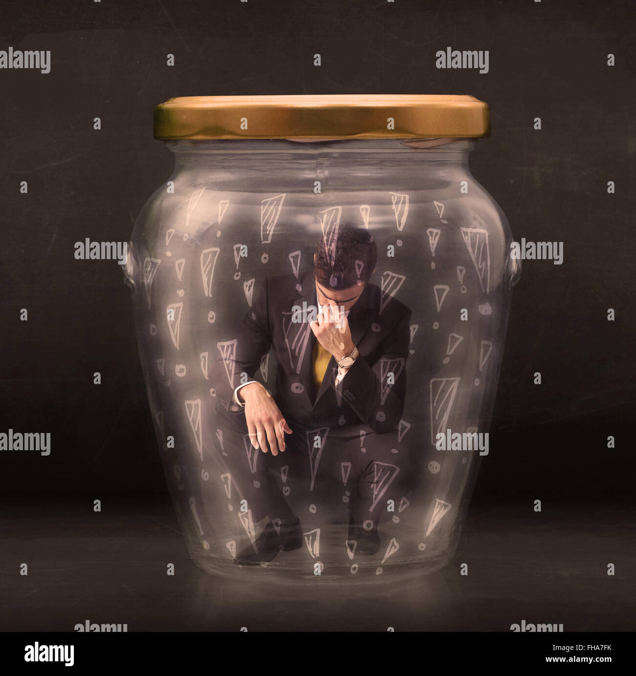 Business man trapped in jar with exclamation marks concept Stock Photo ...