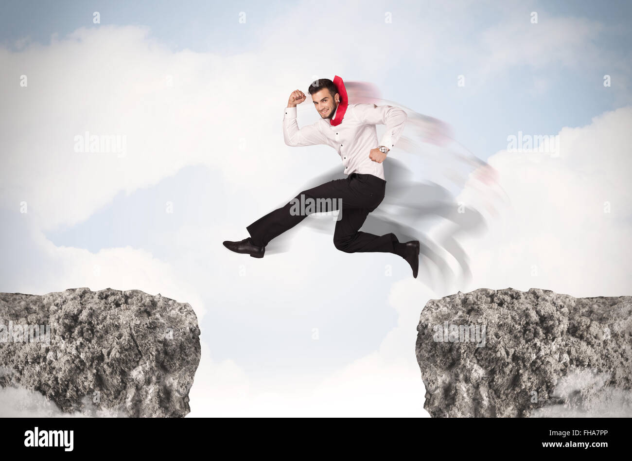 Funny business man jumping over rocks with gap Stock Photo - Alamy