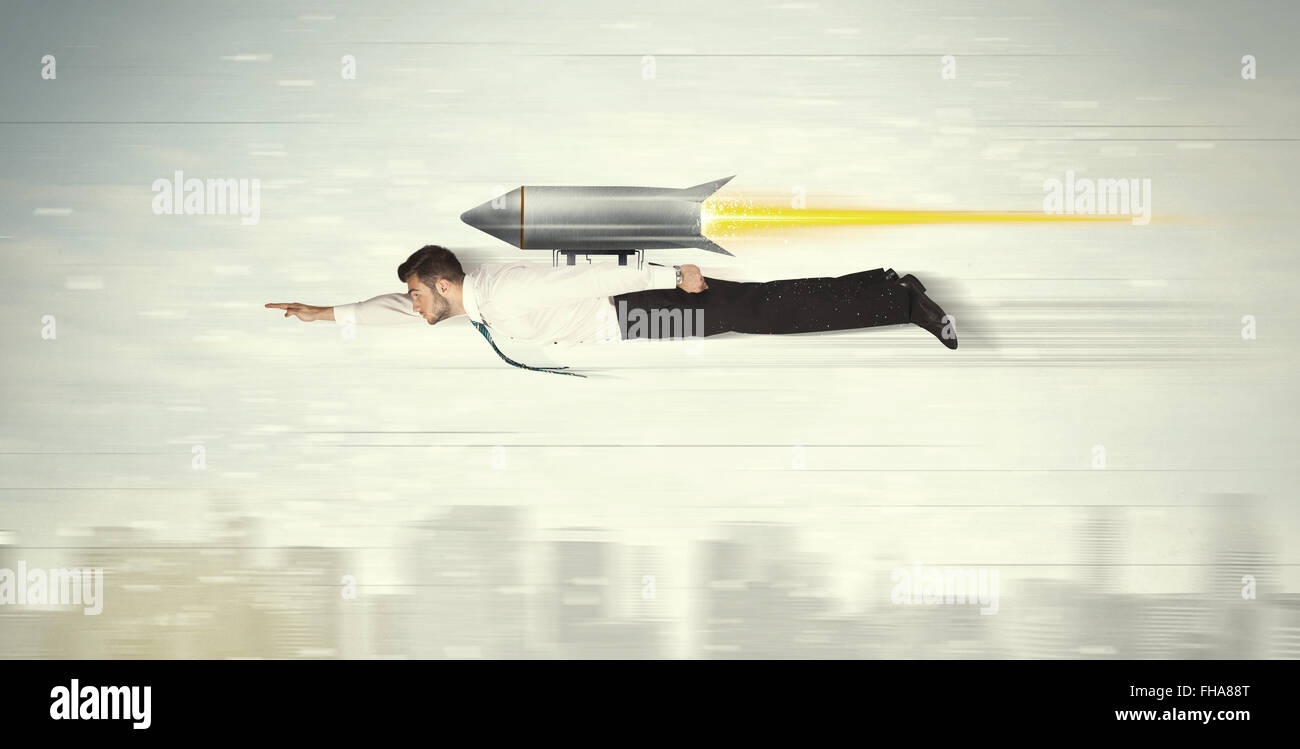 Superhero business man flying with jet pack rocket above the city Stock ...
