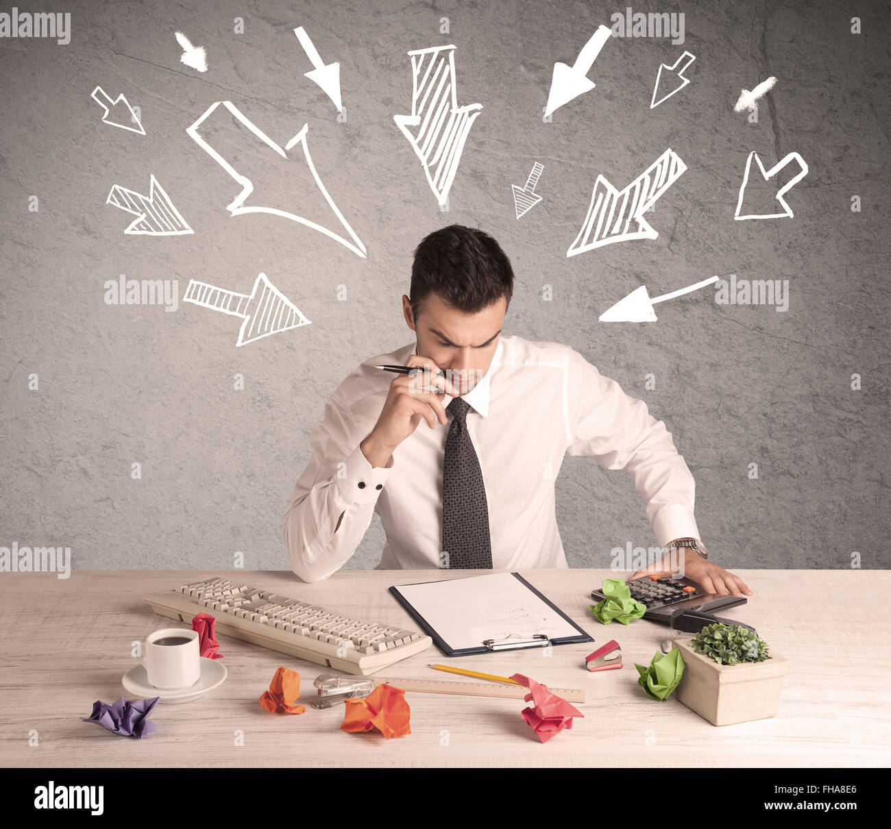 Busy office worker with drawn arrows Stock Photo - Alamy